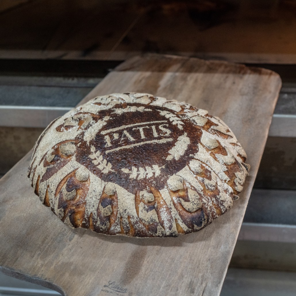 A round pastry sitting on top of a wooden board. - Levana Cooks